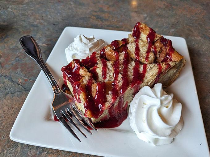 This isn't just dessert; it's edible comfort. Marionberry bread pudding with velvety sauce and whipped cream &ndash; the perfect coastal Oregon finale.