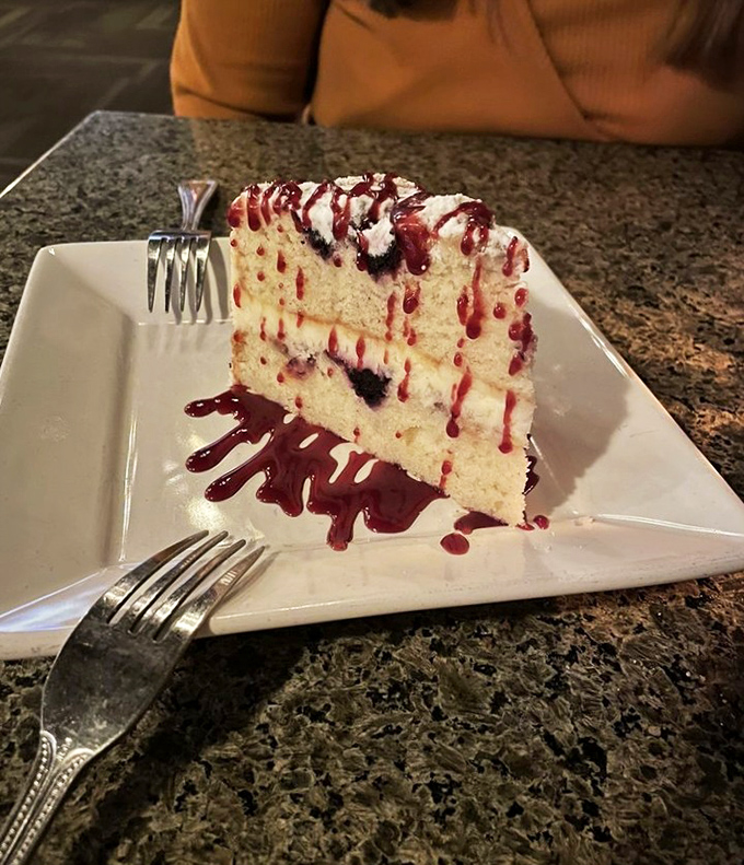 A slice of cake that doesn't just end the meal&mdash;it puts an exclamation point on it. That berry sauce is writing love letters across the plate.