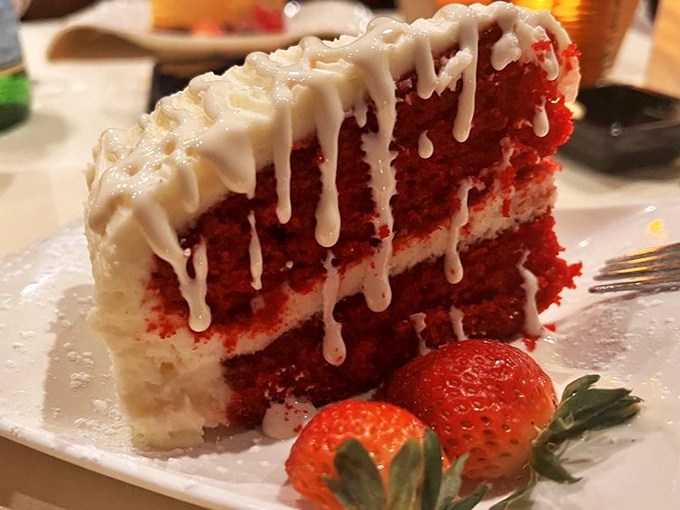 Red velvet cake so photogenic it probably has its own Instagram account. The cream cheese frosting deserves a standing ovation.