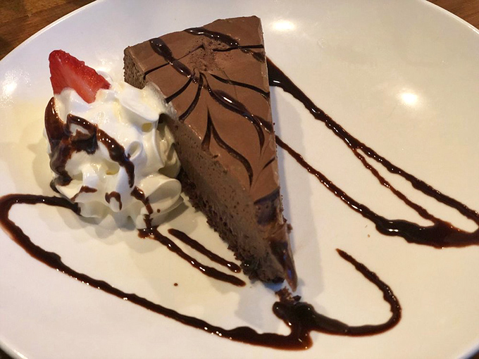 Chocolate cake that doesn't just satisfy your sweet tooth – it throws a party for it, complete with whipped cream and chocolate drizzle confetti.