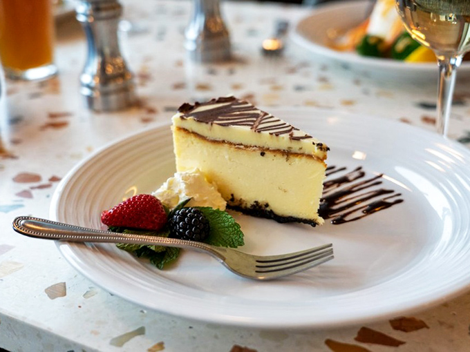 This isn't just cheesecake&mdash;it's a silky cloud of happiness with berry companions that add just enough tartness to keep things interesting.