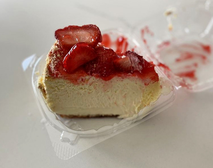 Cheesecake wearing strawberries like a jaunty hat. The perfect sweet finale that somehow finds room in an already satisfied stomach.