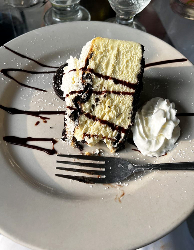 Cheesecake with chocolate drizzle that's dressed for a black-tie event but willing to hang out with anyone willing to pick up a fork.