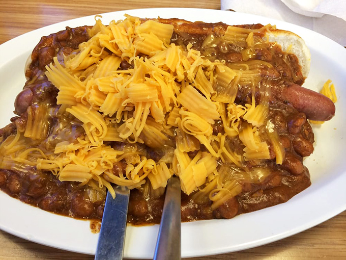 A chili cheese dog that requires both fork and strategic planning. This isn't just a meal&mdash;it's an engineering achievement.