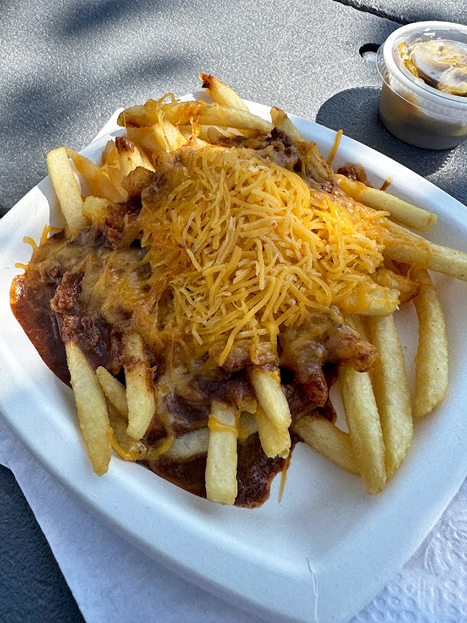 Chili cheese fries: where simple ingredients like potatoes, beef chili, and melted cheese combine to create the ultimate happy-making comfort food.