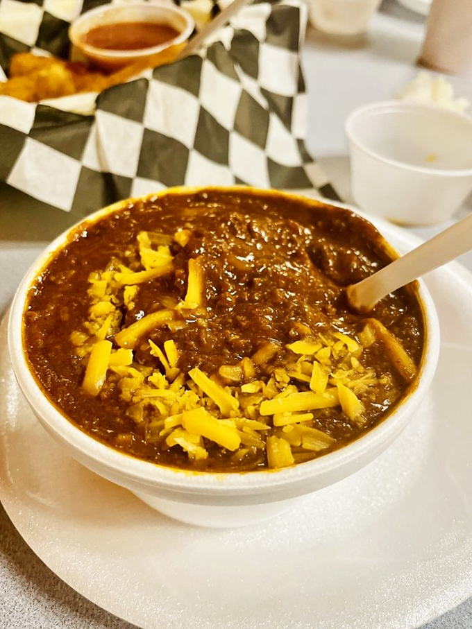 A bowl of homemade chili topped with melted cheese &ndash; winter comfort in a bowl that somehow tastes just as good in Florida's eternal summer.