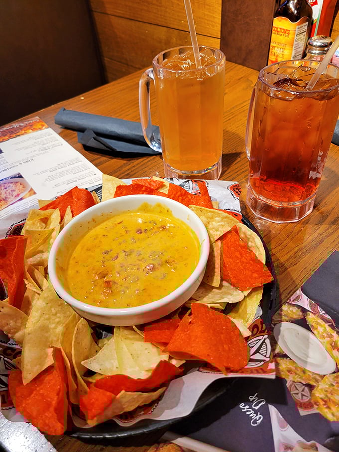 That moment when the queso arrives with technicolor chips, and suddenly everyone at the table becomes your competition.