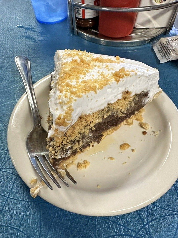 Chocolate peanut butter pie with a graham cracker crust—proof that sometimes the best things in life are indeed still available for the price of a slice.