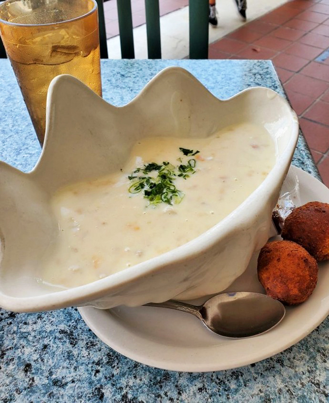 A shell-shaped bowl of clam chowder that tastes like a warm hug from the ocean. Those hush puppies on the side aren't just accompaniments—they're necessities.