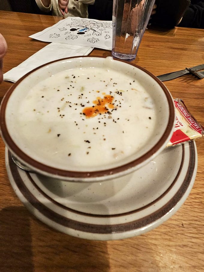 Clam chowder that demands to be savored slowly. Those pepper flecks aren't just garnish—they're little exclamation points in a creamy sea of yes.