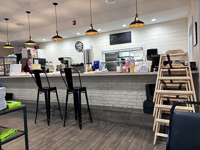 The counter where magic happens, where orders are called and plates emerge bearing comfort food that feels like a warm hug.