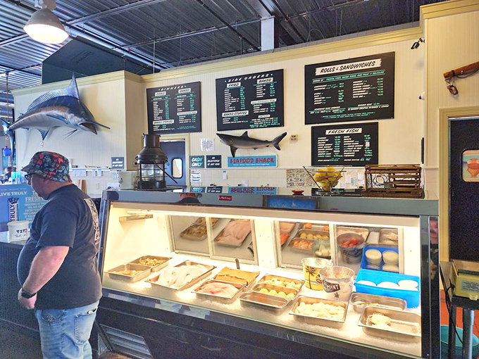 The seafood counter – where the day's fresh catches wait patiently, like contestants on a delicious reality show where everyone's a winner.