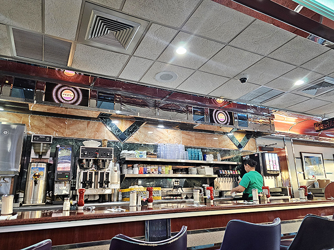 The counter&mdash;where solo diners become temporary family, watching breakfast theater unfold as cooks perform their morning magic.