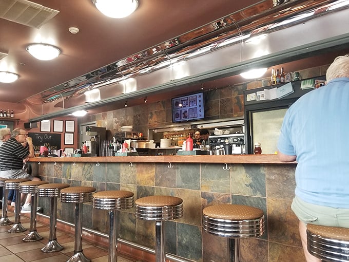 The counter seats &ndash; where breakfast theater unfolds and regulars exchange knowing nods about the coffee's restorative powers.