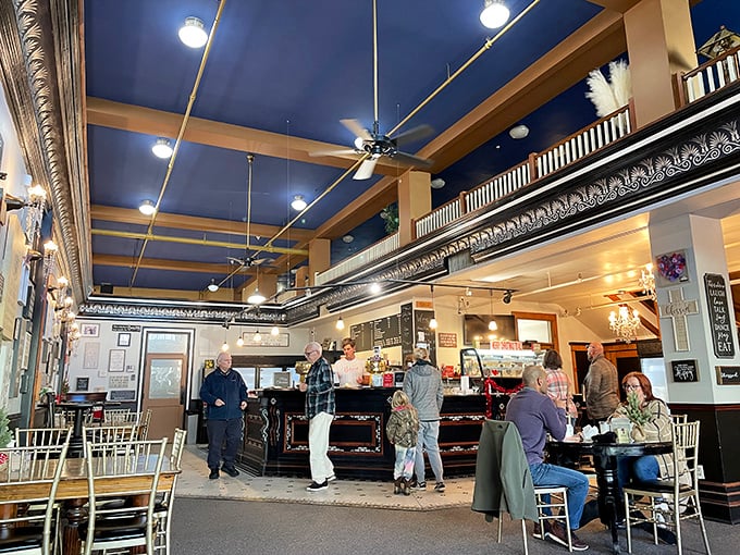 Outside seating under red umbrellas offers the perfect spot to contemplate life's big questions, like "Should I order a second slice?" 