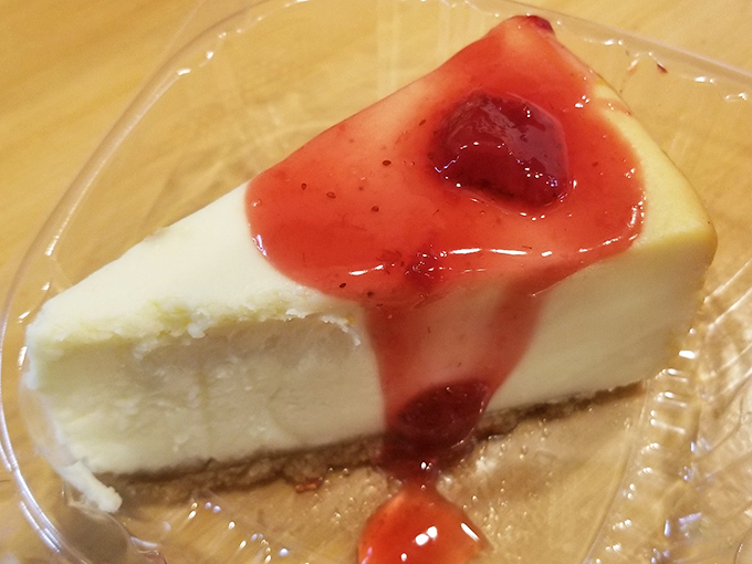 Cheesecake with strawberry topping that makes a compelling argument for always saving room for dessert, no matter how much chicken you've eaten.