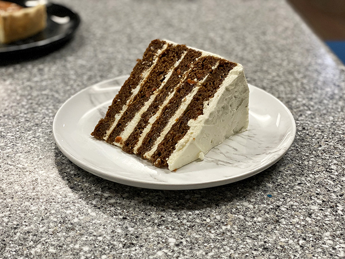 A slice of layer cake that proves seafood restaurants understand an essential truth: after conquering the ocean, you deserve something sweet.