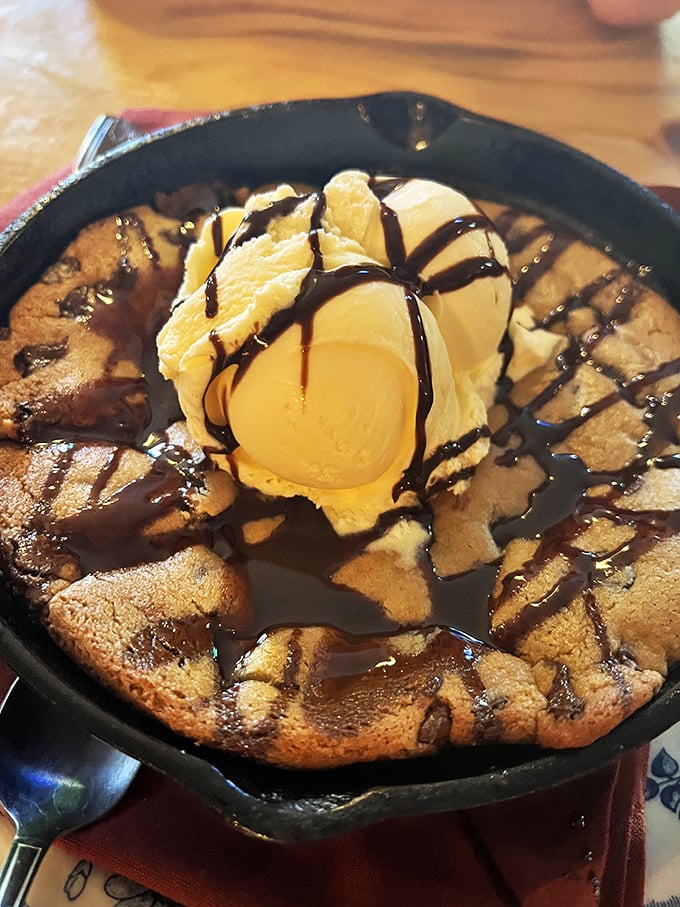 A skillet cookie that arrives sizzling with vanilla ice cream performing its melty magic act. Chocolate drizzle is just showing off at this point. 