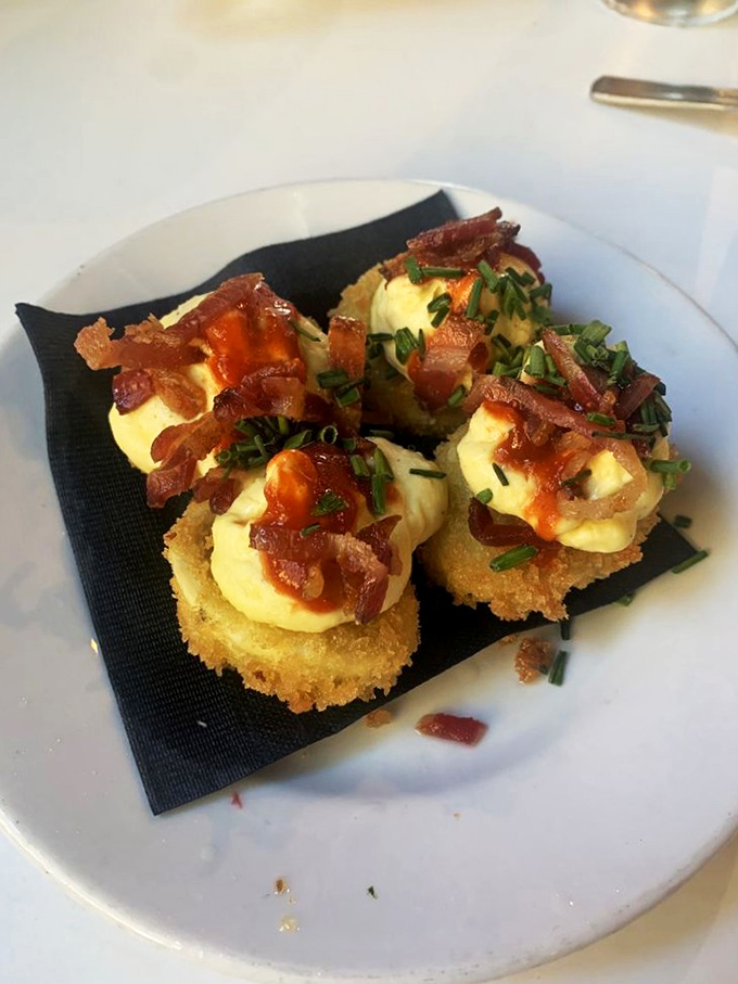 Deviled eggs that have clearly made a deal with the culinary devil. Topped with bacon and chives, they're sinfully good without the guilt of the casino floor.