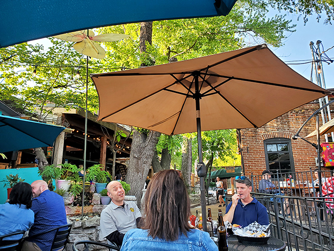The outdoor patio at Molly's: where stranger tables become friends by dessert, and Missouri afternoons stretch into evenings without anyone minding.