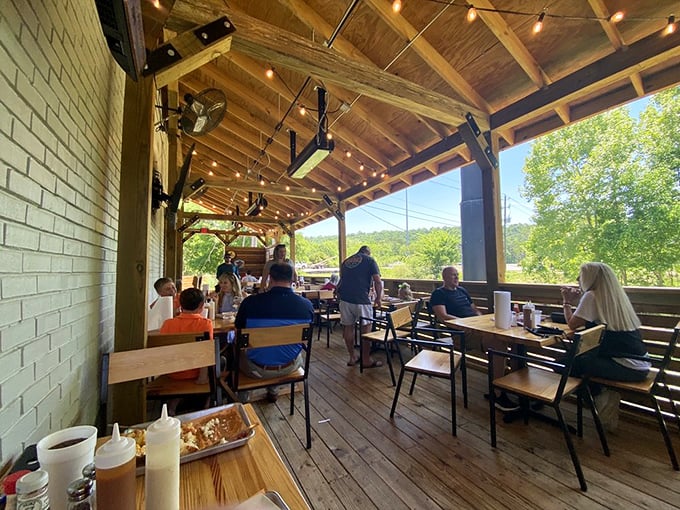 Happiness looks like this: diners gathered on the patio, surrounded by greenery and the promise of smoky delights arriving at any moment.