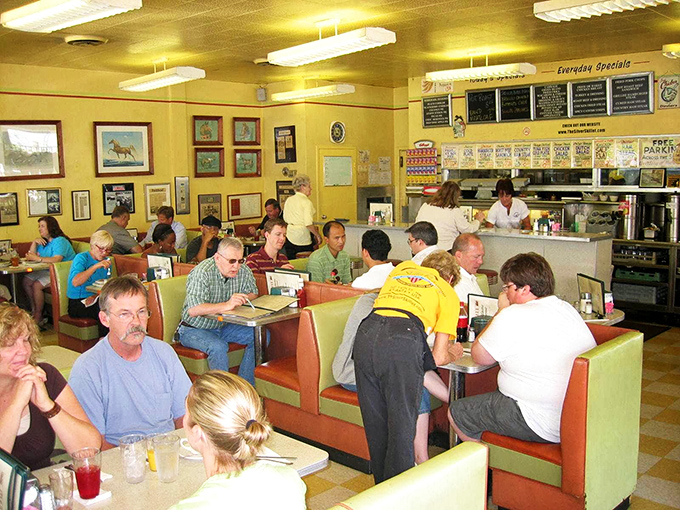 A full house of happy diners proves the universal truth: good breakfast creates a temporary community of strangers united by egg appreciation.