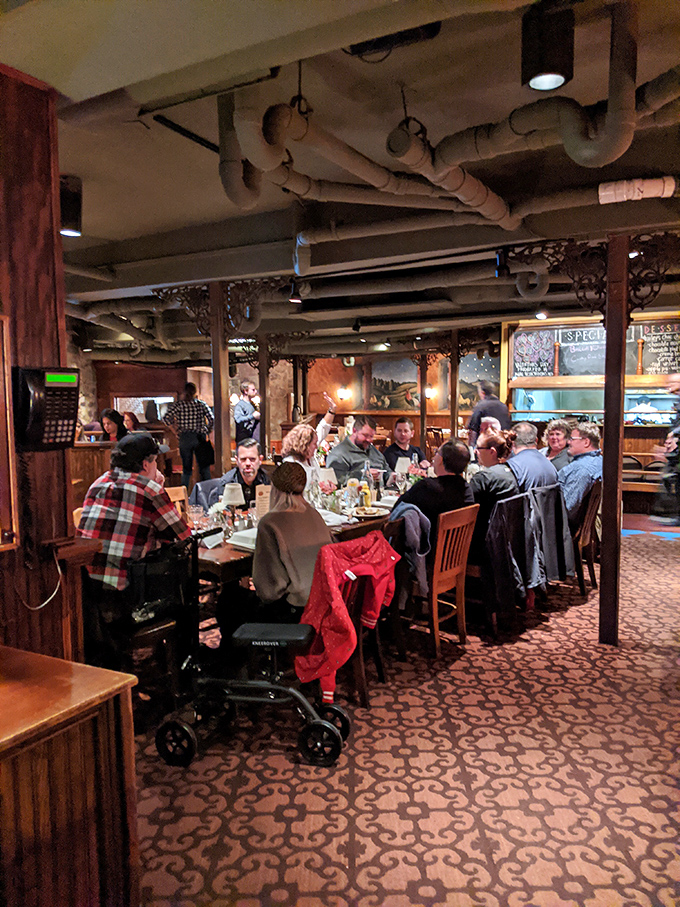 The dining room hums with the universal language of satisfaction. Every table tells a story of celebration, connection, and exceptional food.