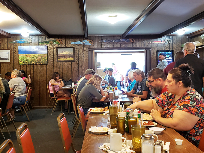 Where strangers become neighbors over coffee and pie. The wood-paneled dining room hums with conversation – the secret ingredient in every great diner.