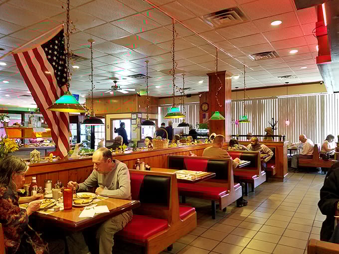 Classic diner booths where countless Delaware stories have unfolded over coffee. Red vinyl seats and hanging lamps create the timeless atmosphere that keeps regulars coming back decade after decade.