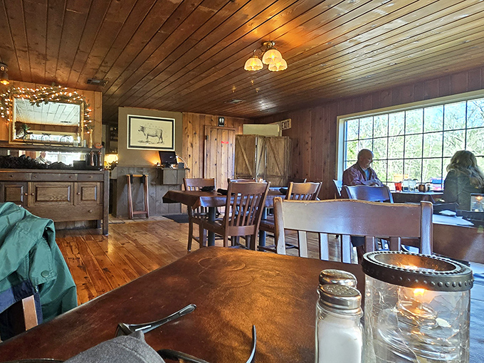 Pine-paneled dining room where conversations flow as smoothly as the iced tea. Memories are made between bites of prime rib.