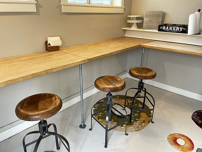 A cozy corner to contemplate your donut choices. These stools have witnessed countless sugar-induced epiphanies and life decisions.