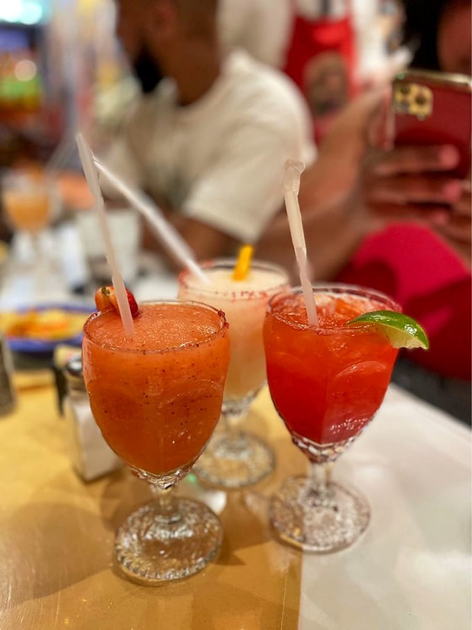 A trio of colorful margaritas standing at attention&mdash;liquid sunshine in glasses that promise to turn an ordinary evening into a memorable night.
