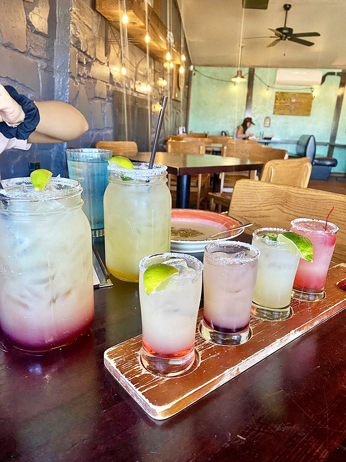 Margaritas lined up like soldiers ready for duty – refreshing, festive, and scientifically proven to pair perfectly with anything containing green chiles.