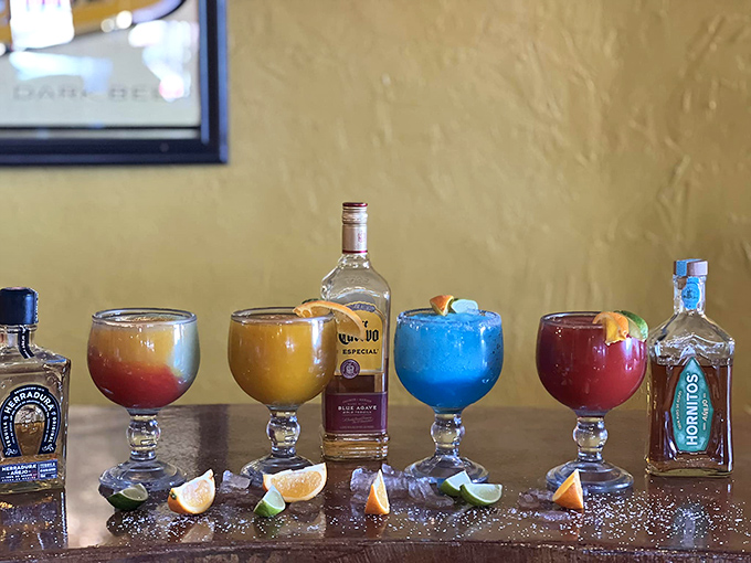 A rainbow of margaritas lined up like delicious soldiers ready for duty. That blue one is definitely the rebel of the group.