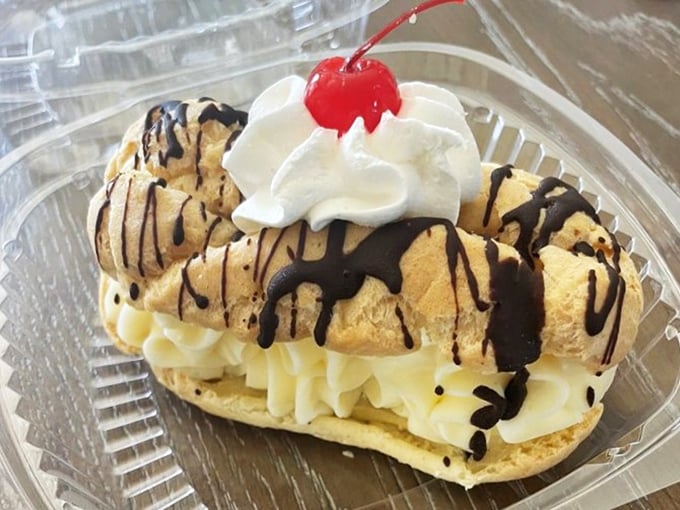 This cream-filled &eacute;clair drizzled with chocolate and topped with a cherry isn't just dessert&mdash;it's edible architecture that tastes even better than it looks.