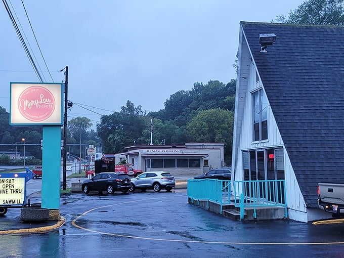 The entrance to happiness is surprisingly simple: a white A-frame with a neon "OPEN" sign and the promise of donuts inside.