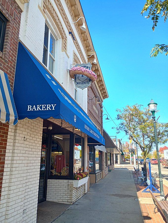 The blue awnings and vintage architecture create the perfect setting for a Michigan food pilgrimage. Curb appeal done right.