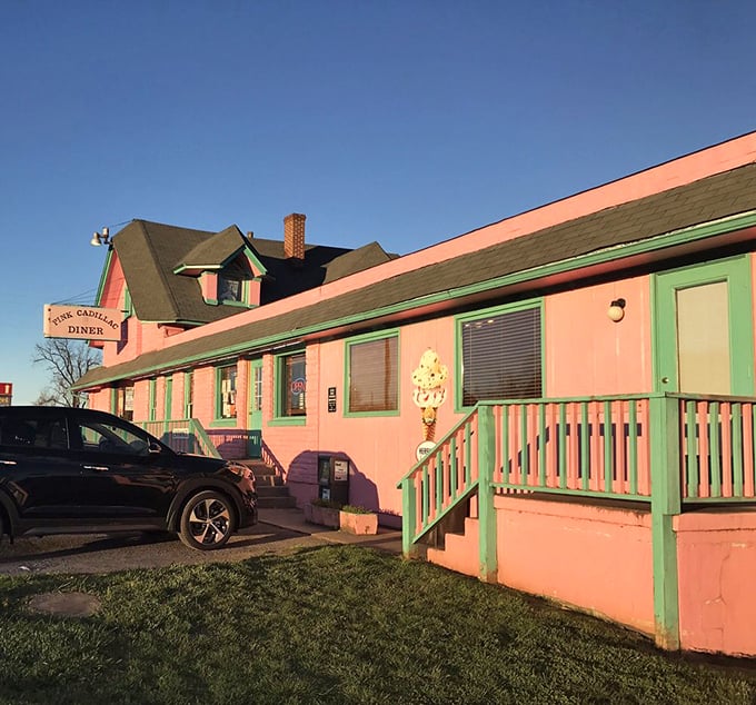 Morning light bathes the pink exterior in a rosy glow, as if the building itself is blushing at all the attention it rightfully receives.