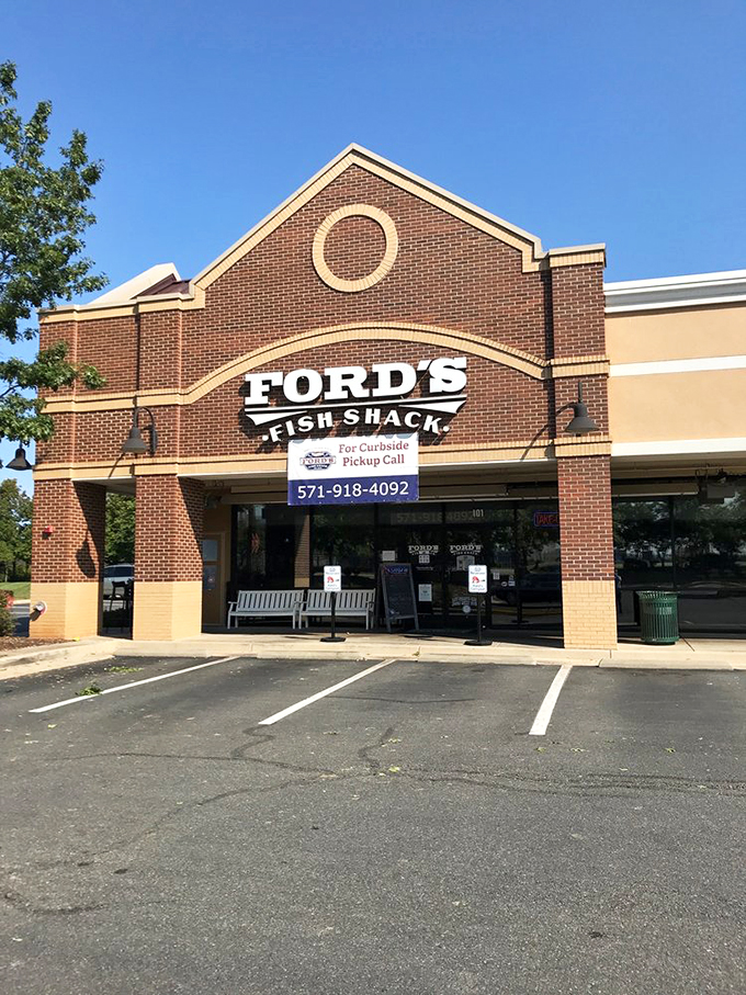 The entrance during daylight reveals the brick-and-mortar temple of seafood worship, where pilgrims arrive seeking clam-induced enlightenment.