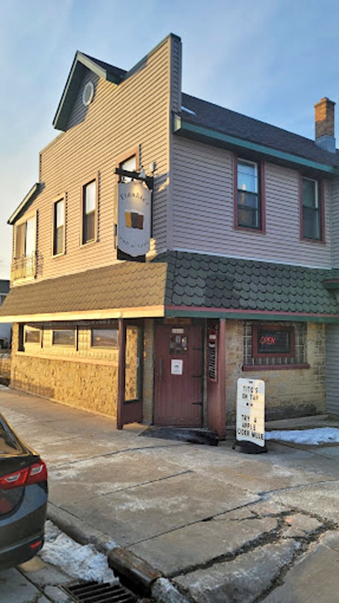 That sign pointing to parking isn't just helpful&mdash;it's the first step on your journey to burger enlightenment. Follow the arrow to happiness.