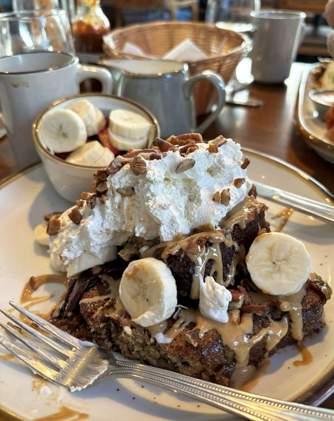 This isn't just French toast&mdash;it's a towering monument to morning decadence, where whipped cream, bananas, and caramel create a breakfast that's basically dessert with permission.