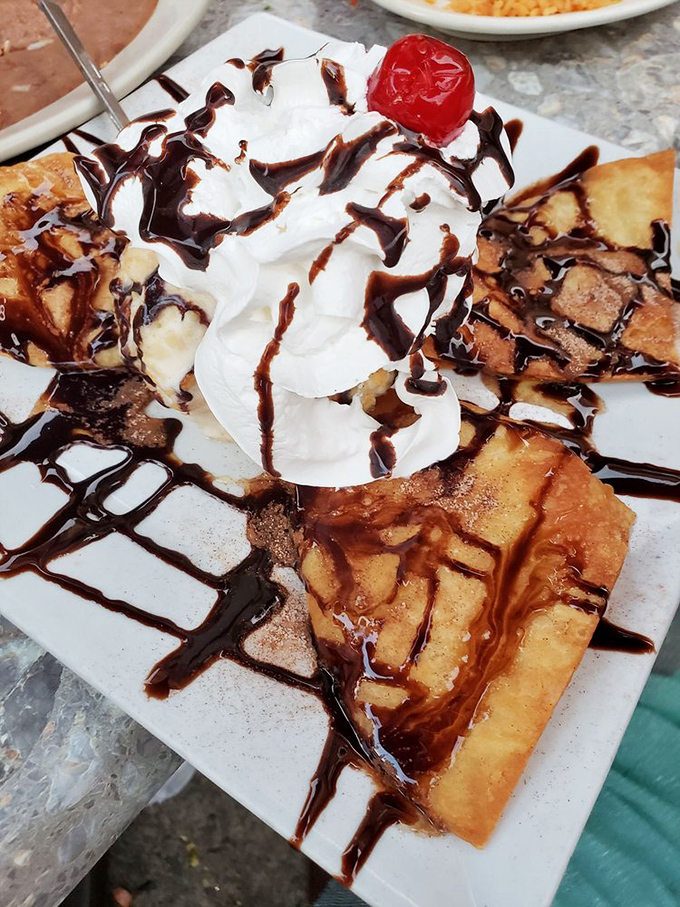 Fried ice cream: dessert's answer to having your cake and eating it too. The chocolate drizzle creates a Jackson Pollock masterpiece you can actually eat.