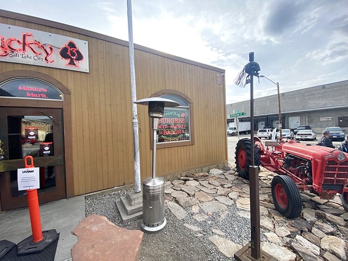 The wooden façade with its neon signage and vintage tractor announces itself without pretension. Burger greatness awaits within.