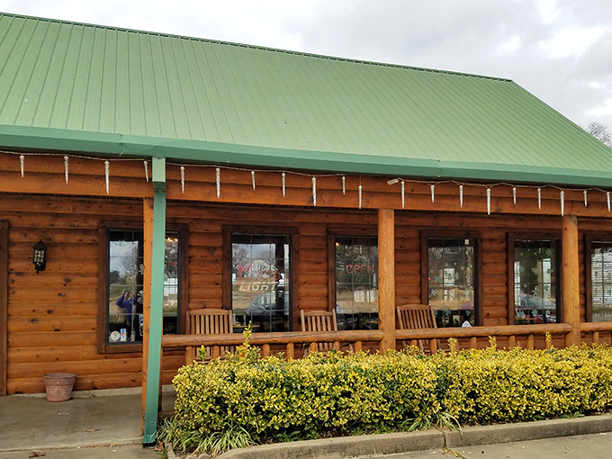 The wooden exterior with its welcoming porch and neat landscaping beckons road-weary travelers like a beacon of hickory-scented hope.