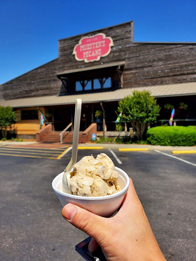 Pecan ice cream with the iconic storefront as backdrop&mdash;a sweet moment frozen in time, both literally and figuratively.