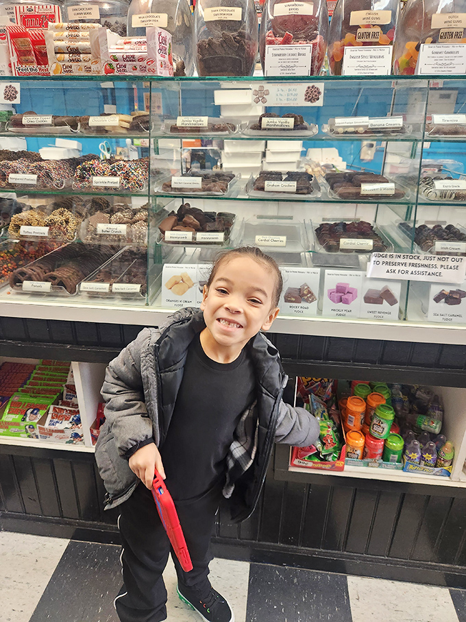 The universal expression of pure joy that can only come from standing before a wall of chocolate with permission to indulge.