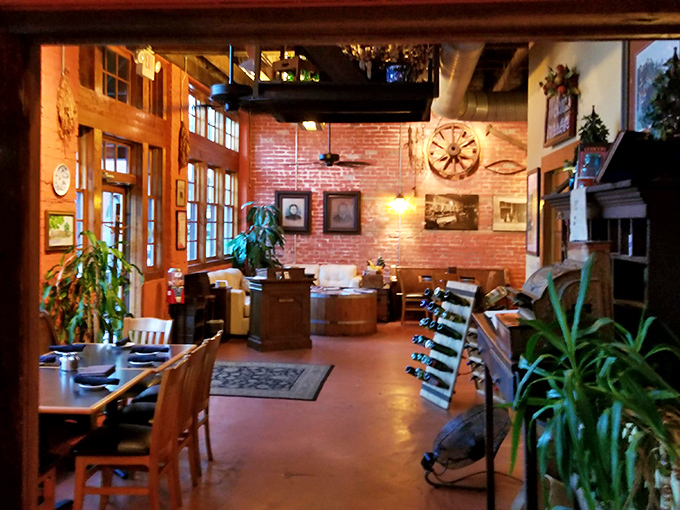 Warm lighting, exposed brick, and wooden accents create a welcoming atmosphere that feels both sophisticated and comfortably familiar.