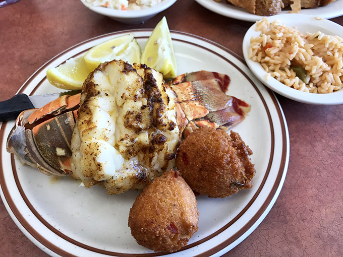 This isn't just a lobster tail&mdash;it's a masterclass in simplicity. Perfectly grilled, served with hushpuppies that could make a Southerner weep.