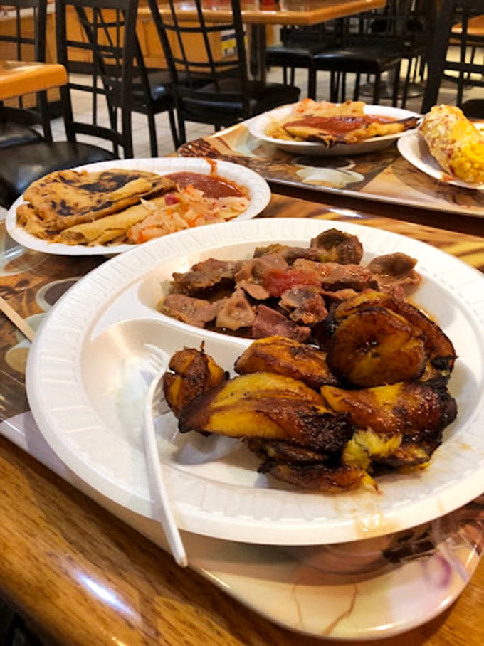 This isn't just lunch; it's a symphony of flavors. Crispy plantains, savory meats, and tamales that make you want to hug the chef.