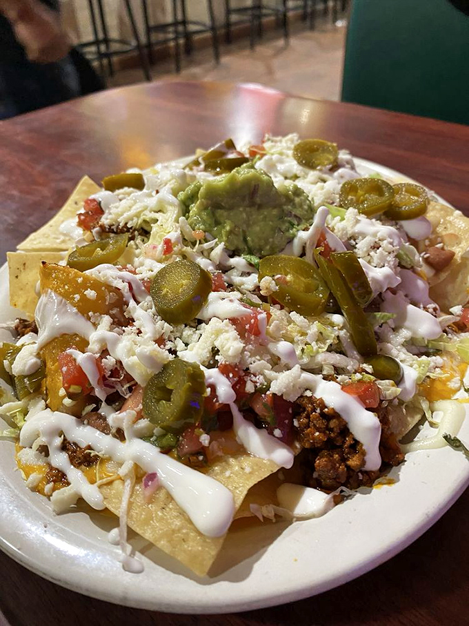 These nachos aren't the sad, concession-stand variety&mdash;they're a mountain of joy topped with jalape&ntilde;os, guacamole, and enough cheese to make Wisconsin proud.